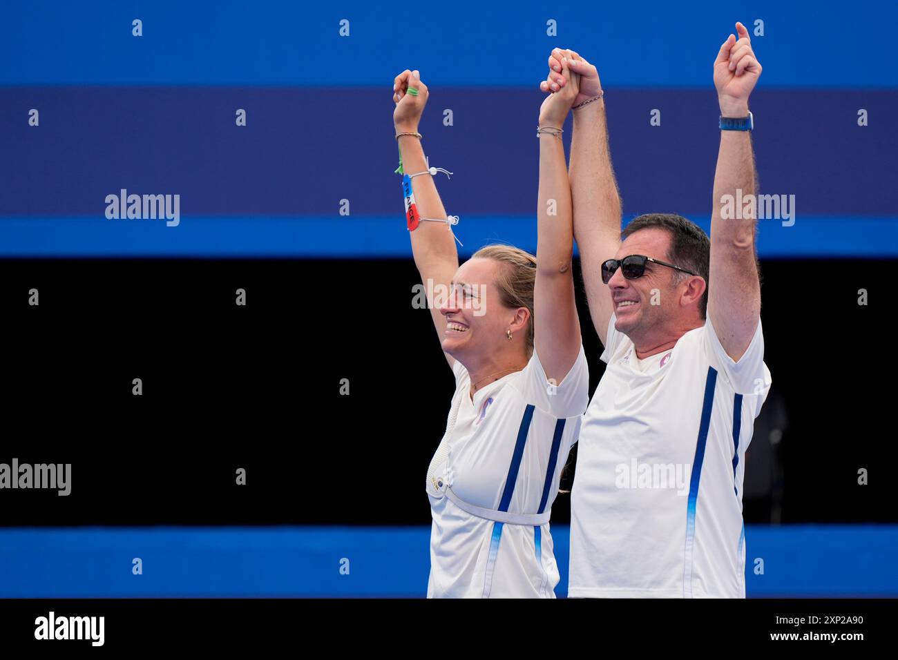 France's Lisa Barbelin, left, celebrates with her coach Jean-Manuel ...