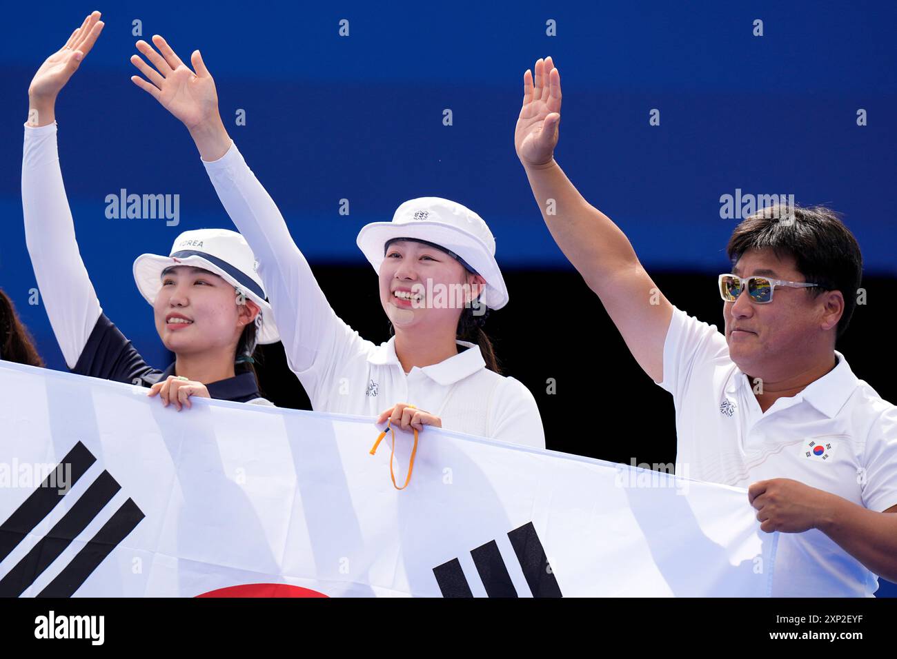 South Korea's Lim Si-hyeon, center, celebrates with her coach Yang ...