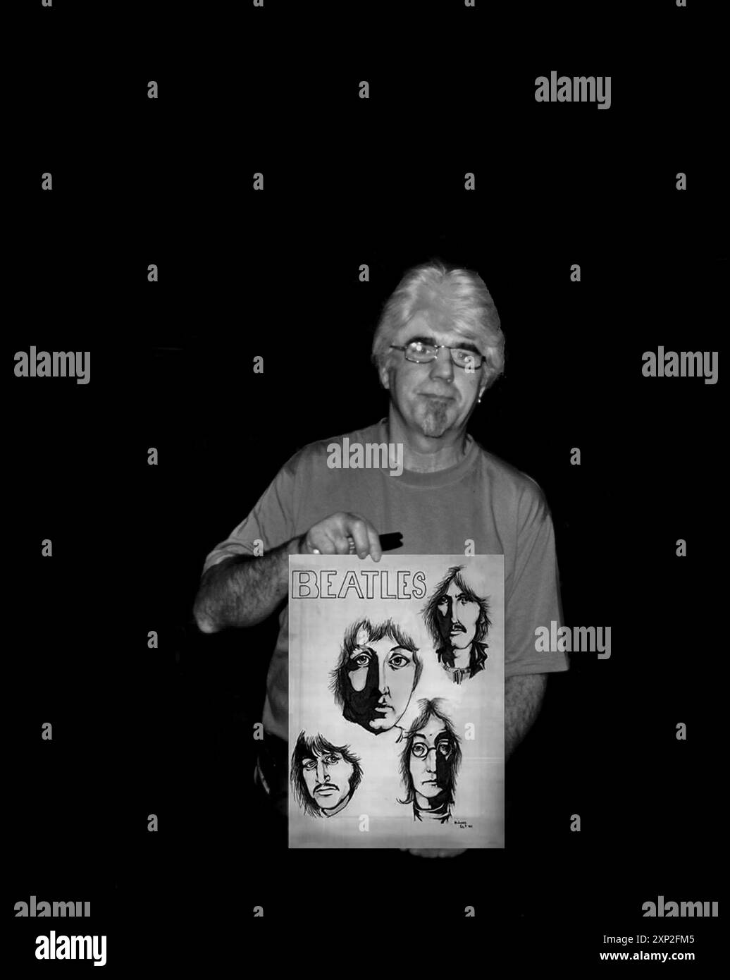 American singer Michael McDonald holds a drawing he made of the Beatles ...