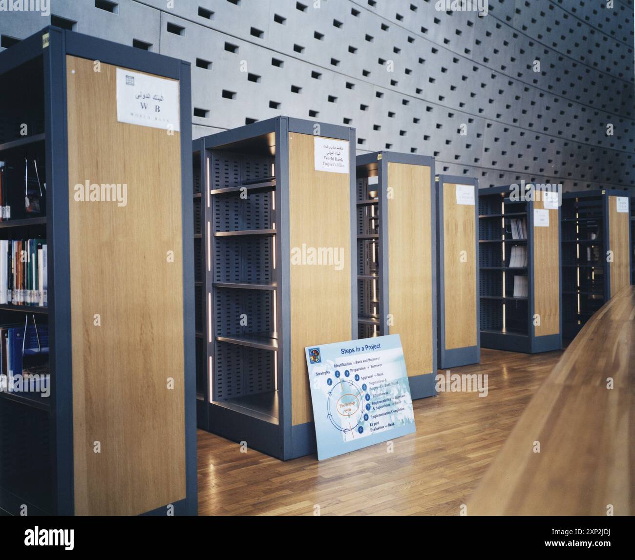 Interior of Bibliotheca Alexandrina featuring wooden bookshelves and an ...