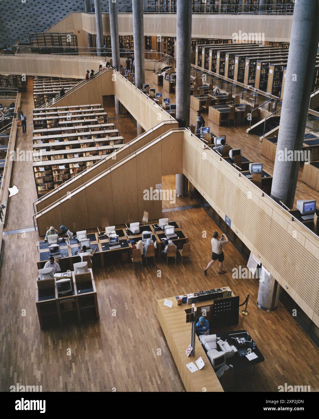Spacious interior of Bibliotheca Alexandrina with students studying and ...