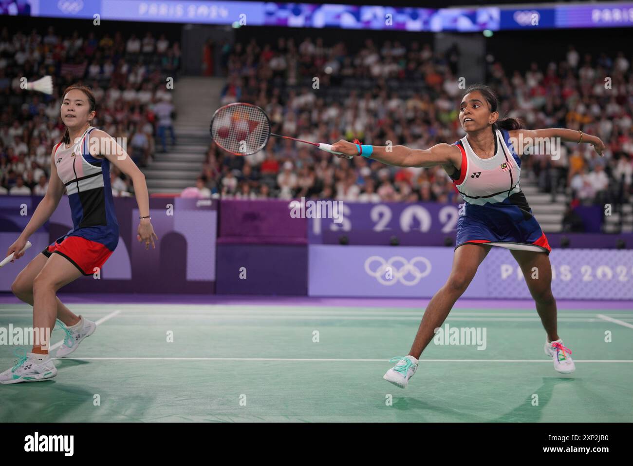 Malaysia's Pearly Tan and Muralitharan Thinaah play against Japan's Nami Matsuyama and Chiharu ...