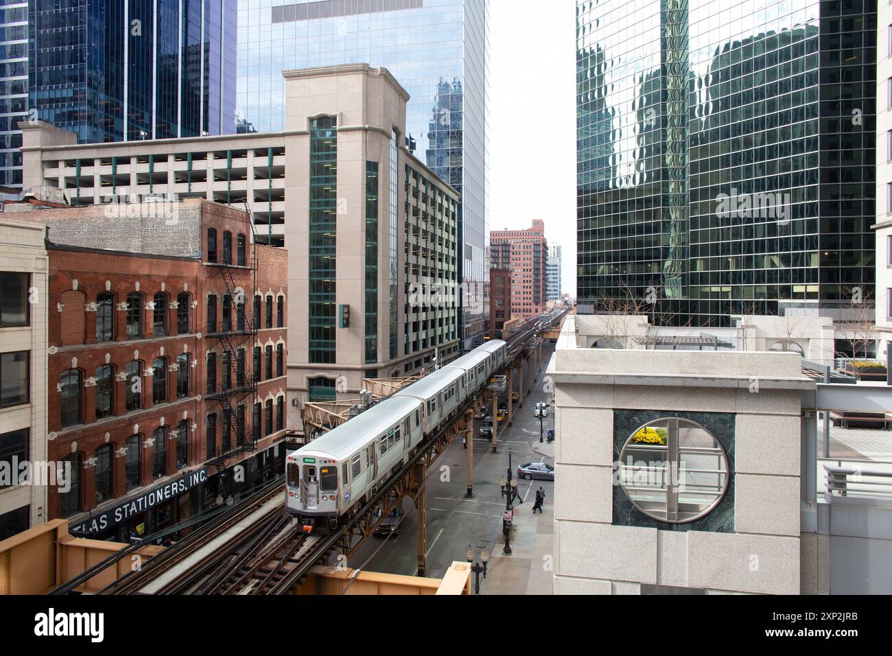 Elevated view of a subway train traveling through downtown Chicago, USA ...
