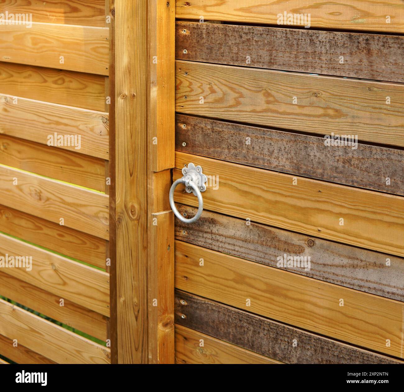 Wooden gate with ring lock for security and safety in the garden of a ...
