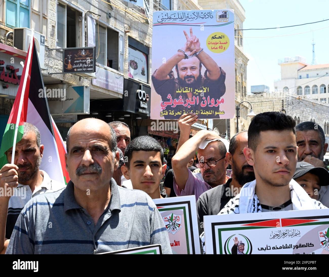Bethlehem, West Bank. 03rd Aug, 2024. A man holds a poster of Marwan ...
