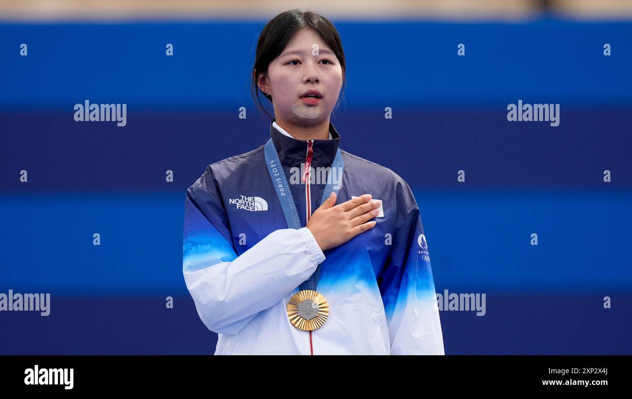 South Korea's Lim Si-hyeon stands for the national anthem on the podium ...