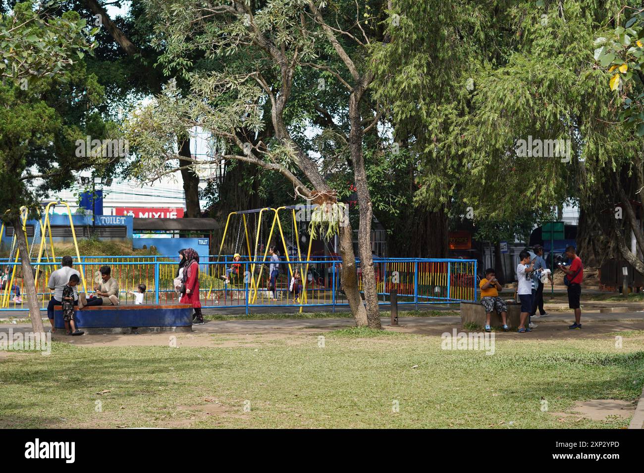 The park in the busy town square of Malang in the morning Stock Photo ...