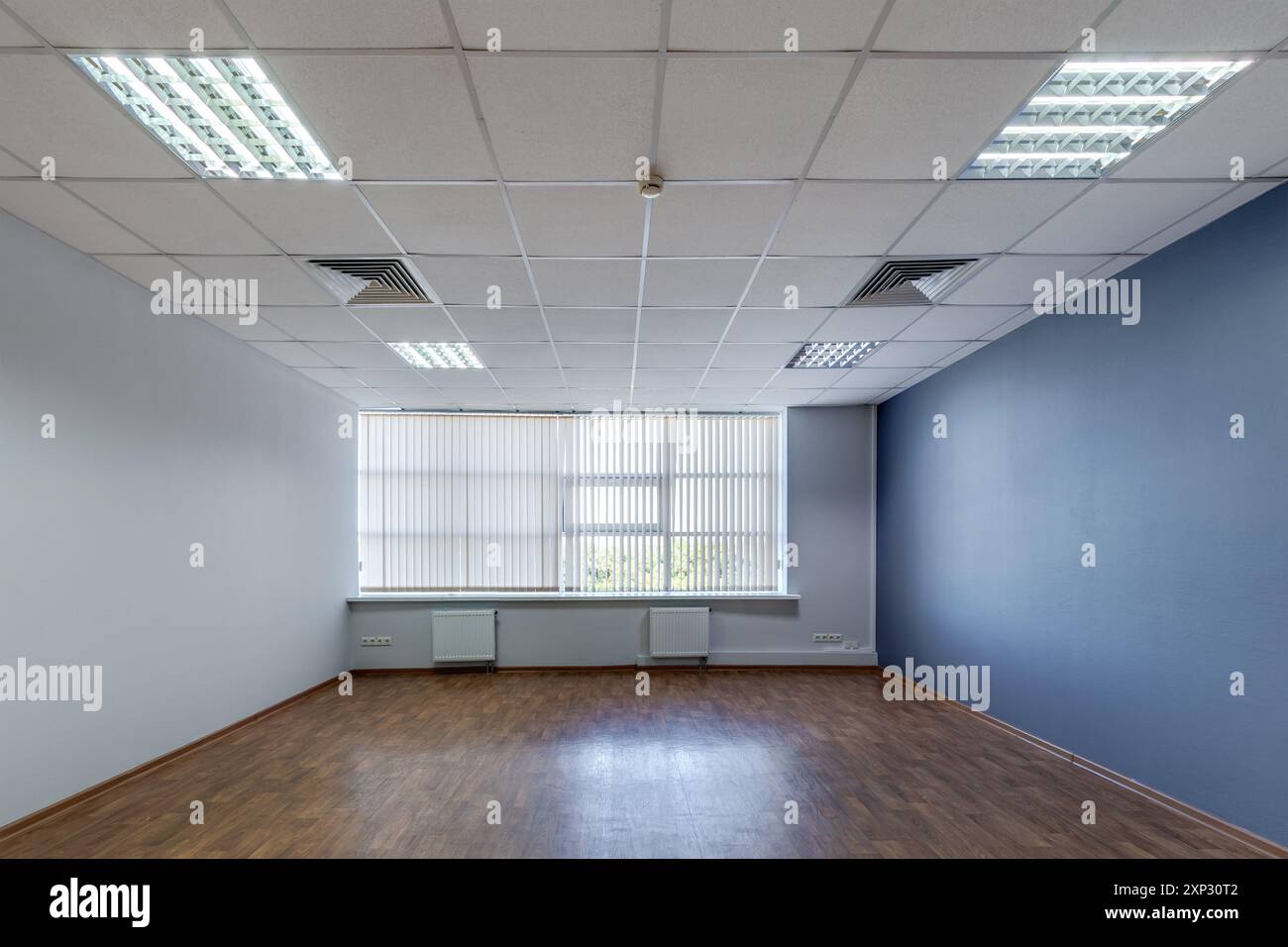 panorama view in empty modern office hall with sunlight in windows ...