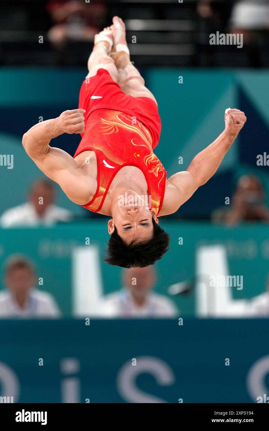Zhang Boheng, of China, competes during the men's artistic gymnastics ...