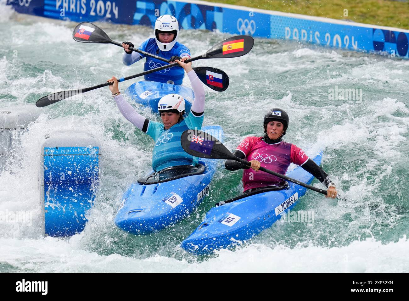 Luuka Jones of New Zealand, from right, competes in the women's kayak ...