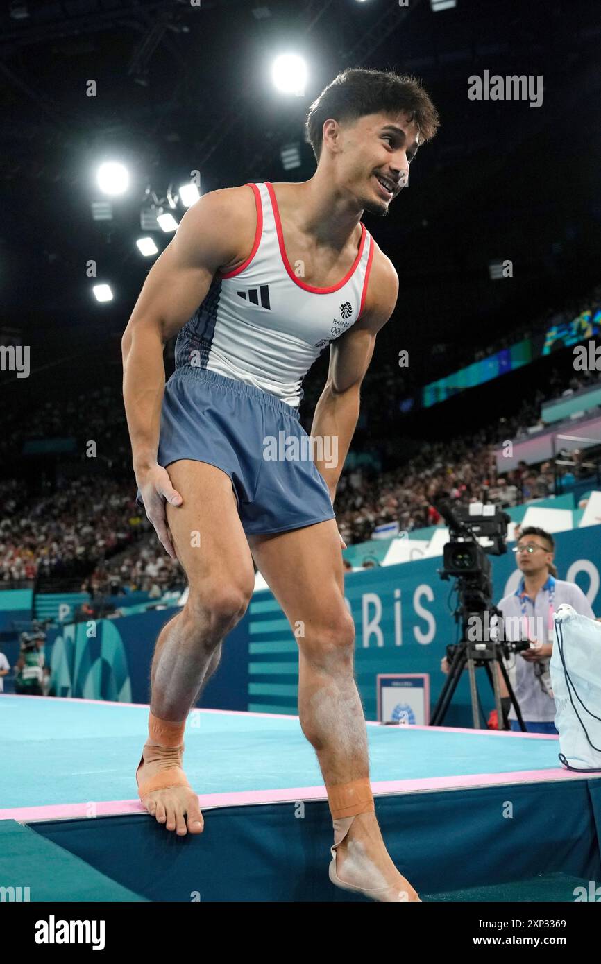 Jake Jarman, of Britain, reacts as he steps off the mat after competing ...