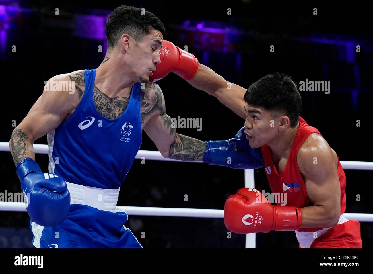 Philippines' Carlo Paalam, right, fights Australia's Charlie Senior in ...