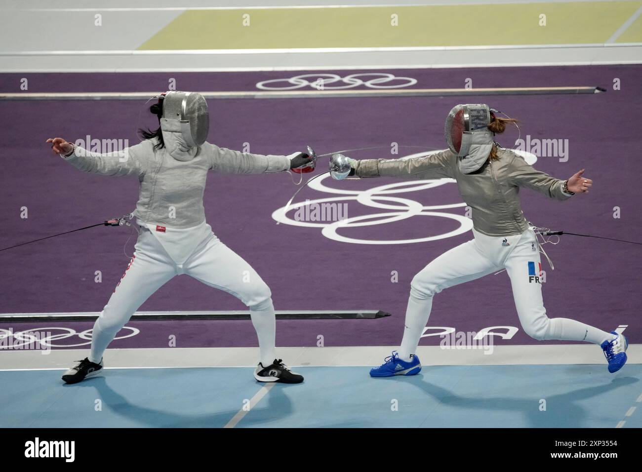 South Korea's Choi Sebin, left, competes with France's Manon Apithy ...