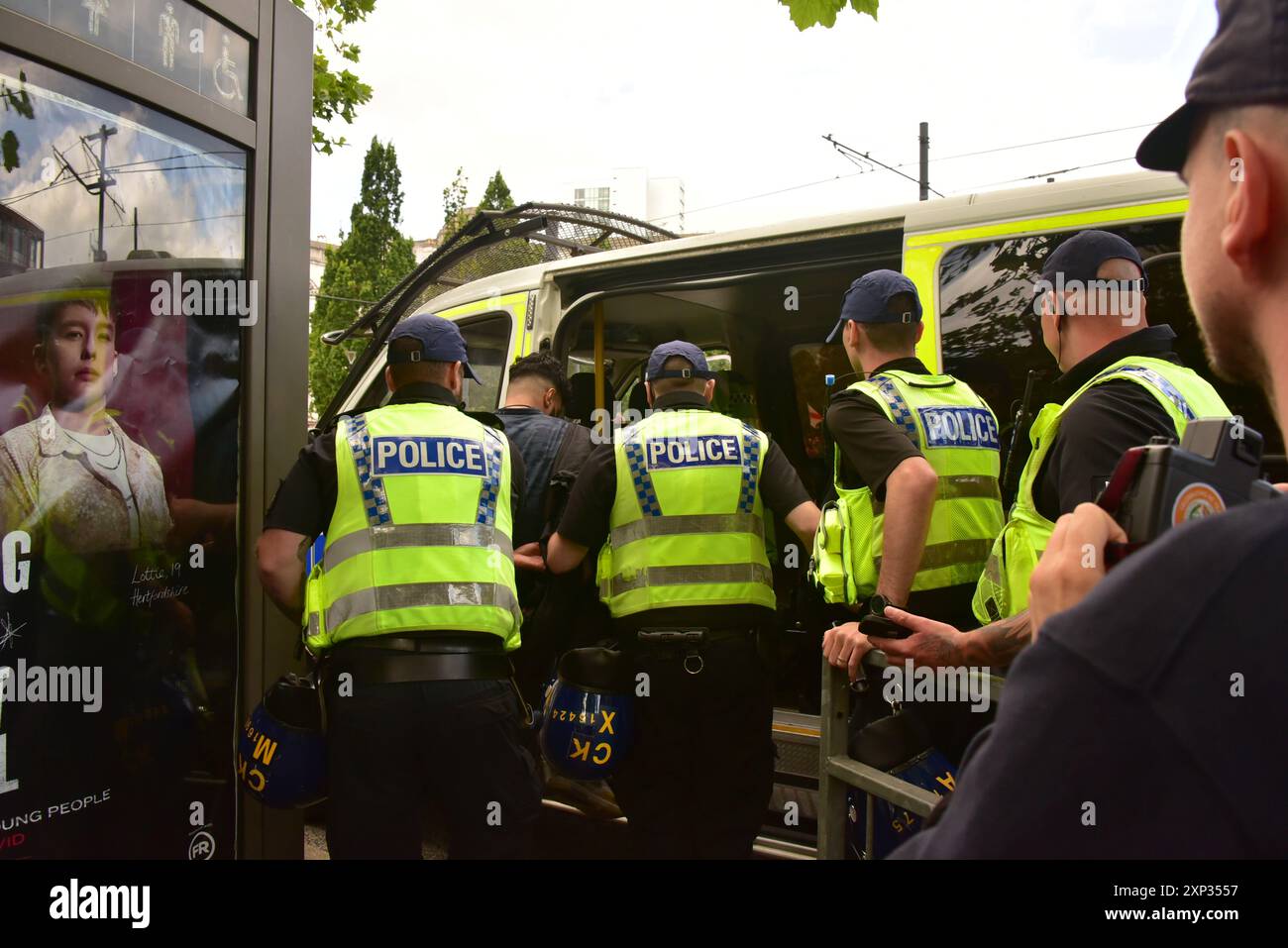 Manchester, UK, 3rd August, 2024. Man detained by police officers and ...