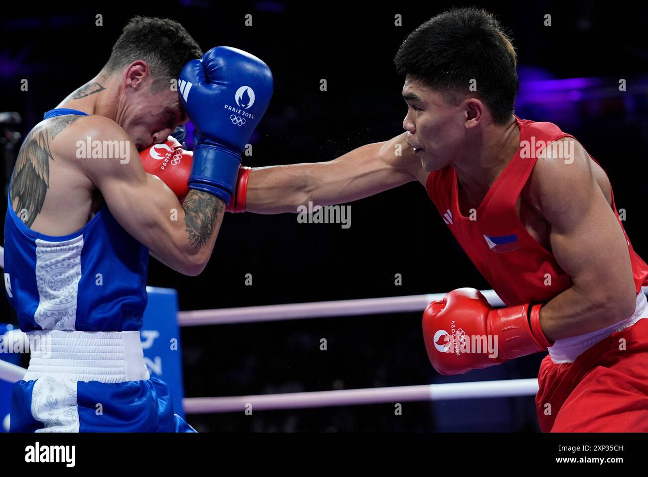 Philippines' Carlo Paalam, right, fights Australia's Charlie Senior in ...