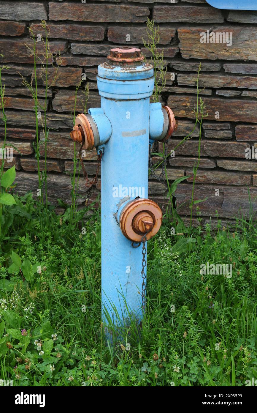 An old blue fire hydrant with rusty connectors Stock Photo - Alamy