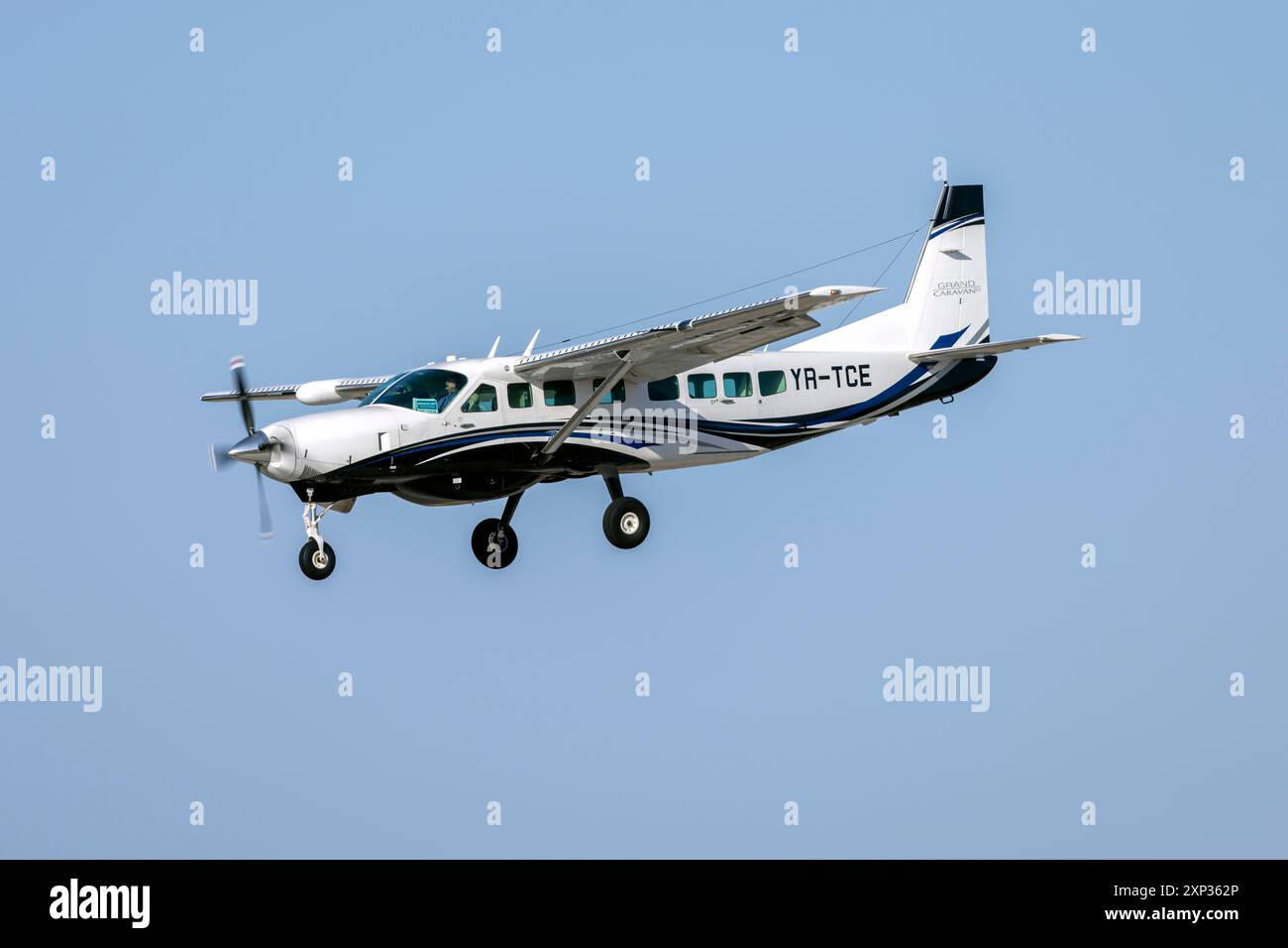 Private Cessna 208B Grand Caravan EX (REG: YR-TCE) on finals runway 31 ...