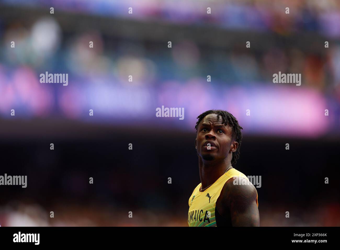 Ackeem Blake of Team Jamaica looks during the Men's 100m Round 1 on day ...