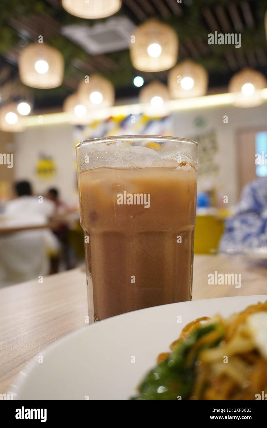 Refreshing iced chocolate drink in a clear glass at a restaurant Stock ...