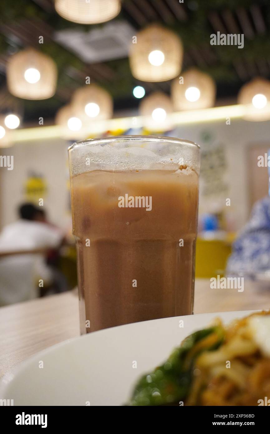 Refreshing iced chocolate drink in a clear glass at a restaurant Stock ...