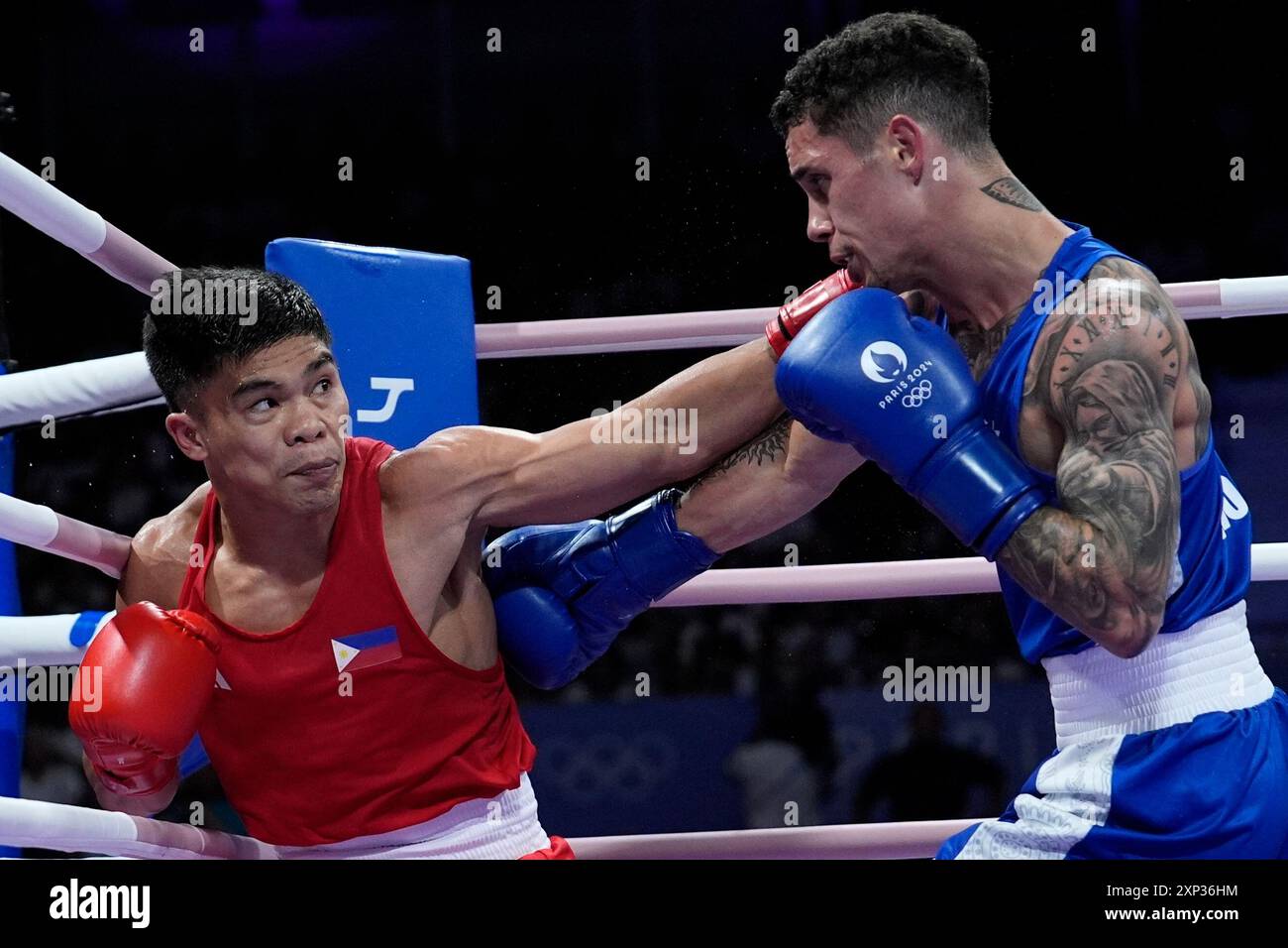 Philippines' Carlo Paalam, left, fights Australia's Charlie Senior in ...