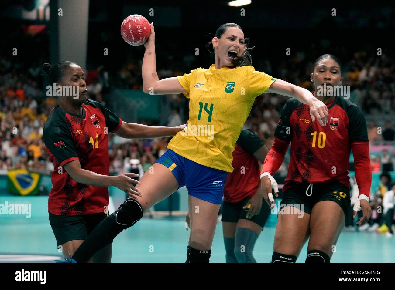 Ana Claudia Bolzan, of Brazil, attempts to score past Albertina Kassoma ...