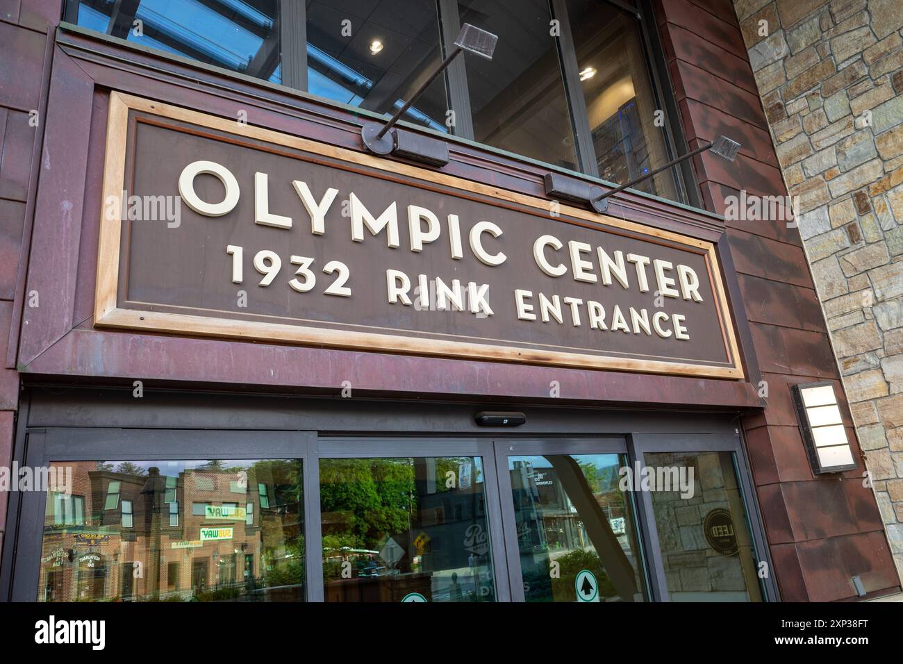The iconic Olympic Center sign shines at the rink entrance, proudly ...