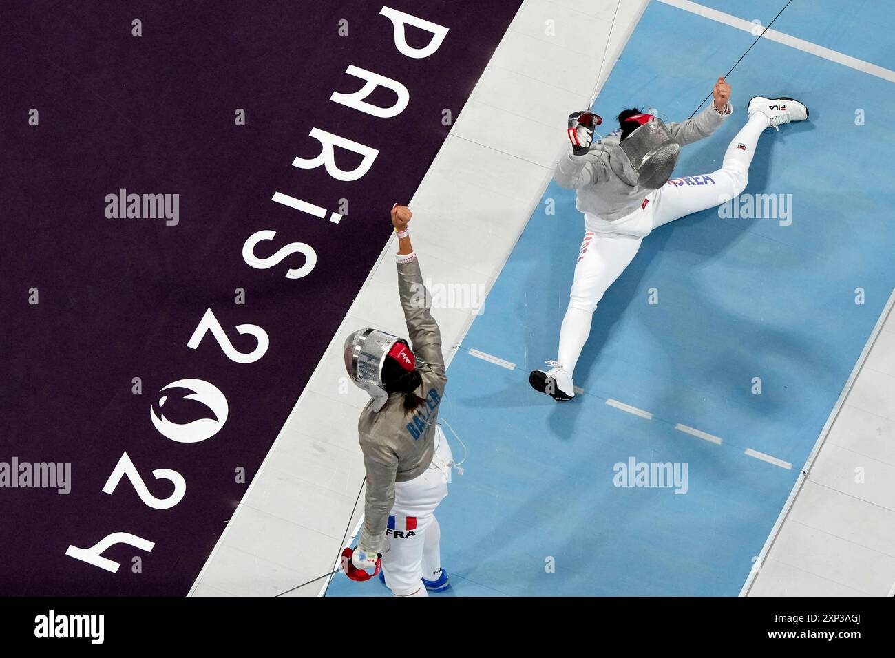 France's Sara Balzer, left, and South Korea's Jeon Hayoung compete in ...