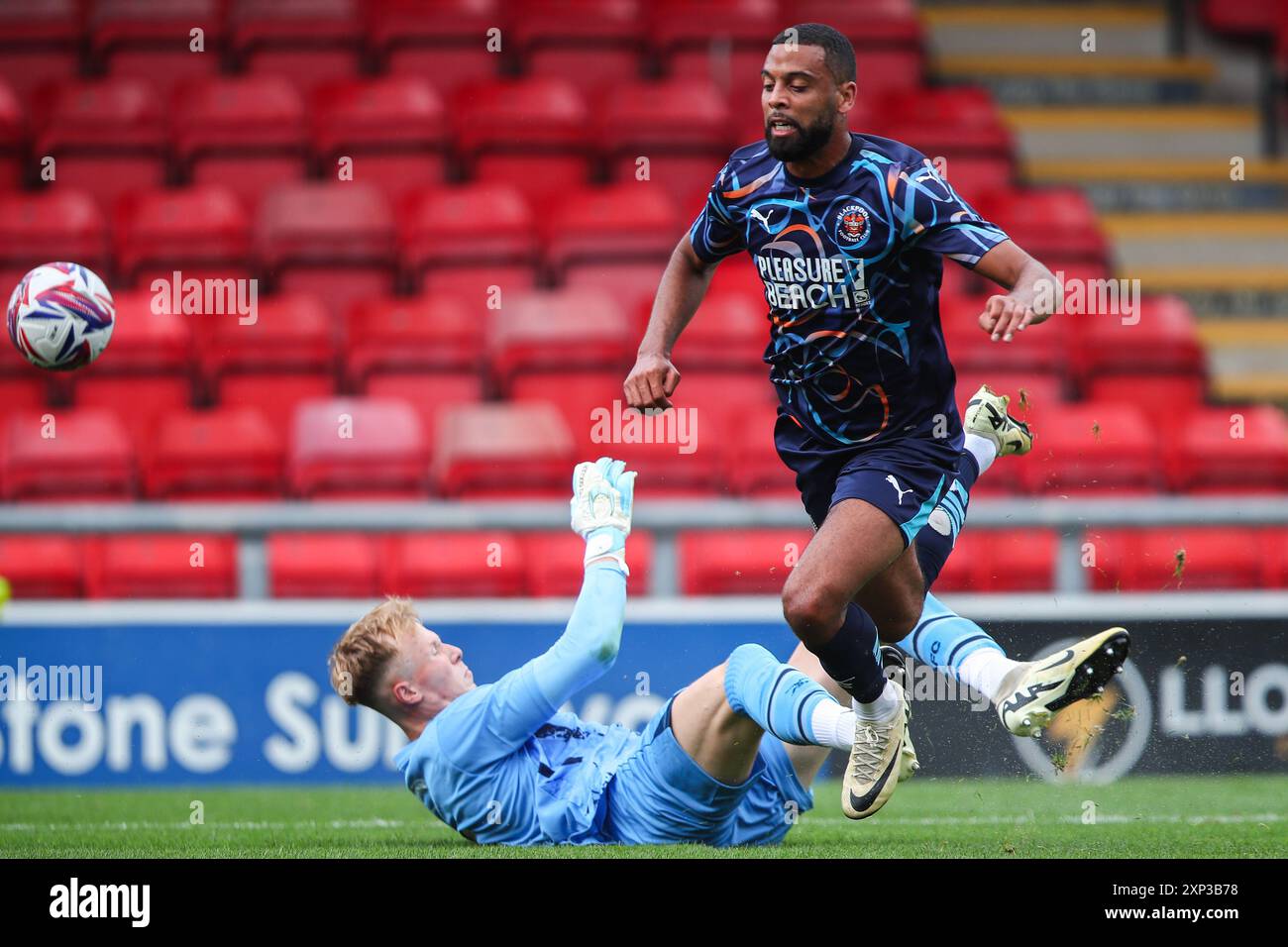 Filip Marschall of Crewe Alexander tackles CJ Hamilton of Blackpool ...