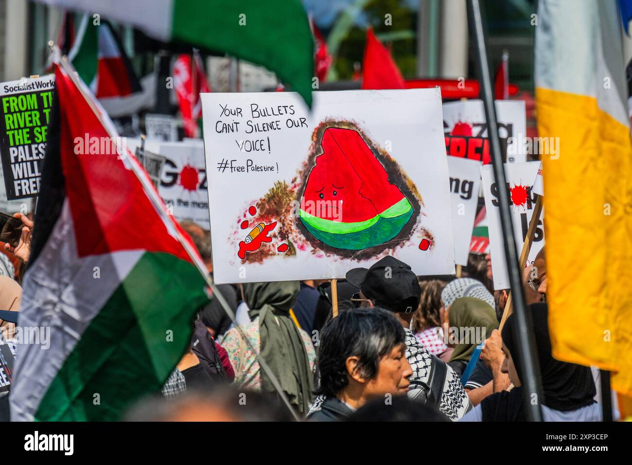 London, UK. 3rd Aug, 2024. Watermelon (a symbol of Palestine) signs are ...