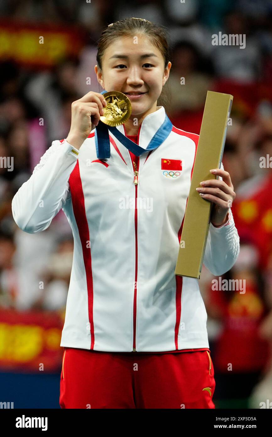 China's Chen Meng poses with the gold medal after defeating China's Sun Yingsha in the women's ...