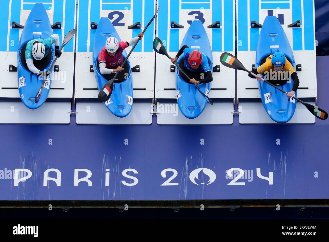 Eva Alina Hocevar of Slovenia, from left, competes in the women's kayak ...
