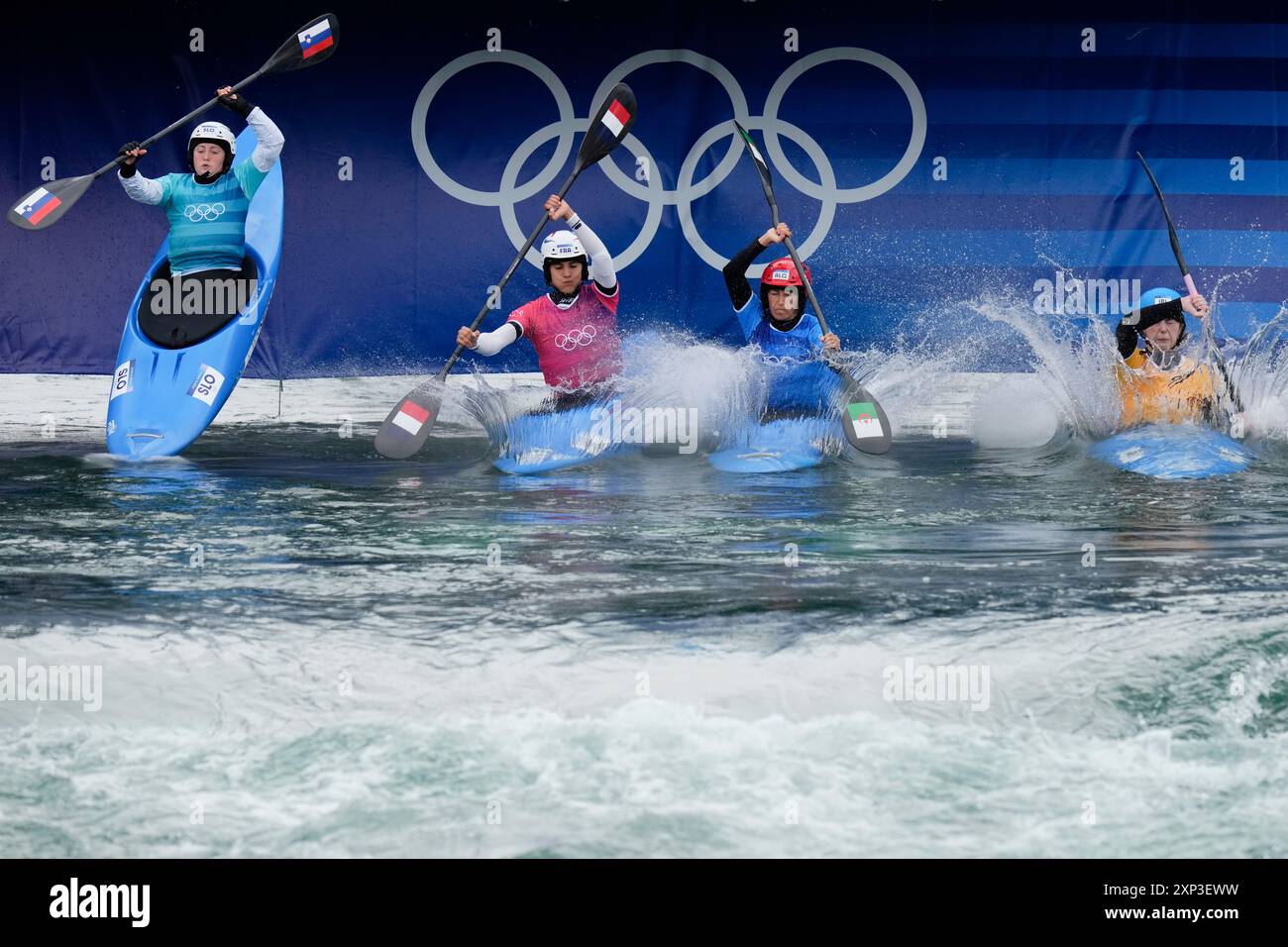 Eva Alina Hocevar of Slovenia, from left, competes in the women's kayak ...
