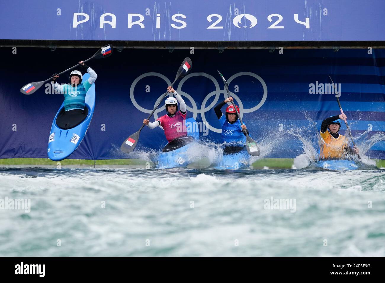 Eva Alina Hocevar of Slovenia, from left, competes in the women's kayak ...