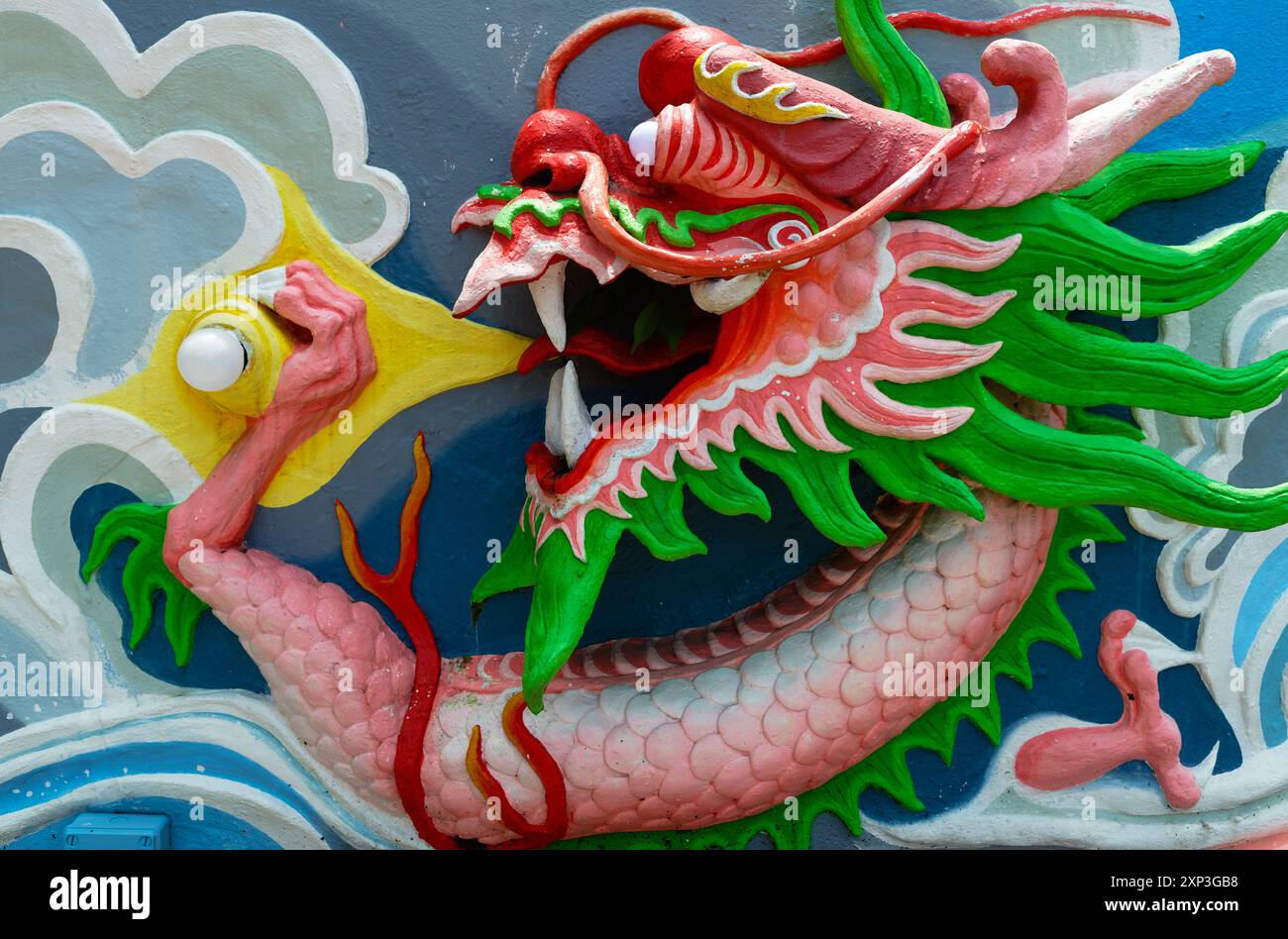 Colourful dragon carvings on the outside of the Tua Pek Kong chinese ...