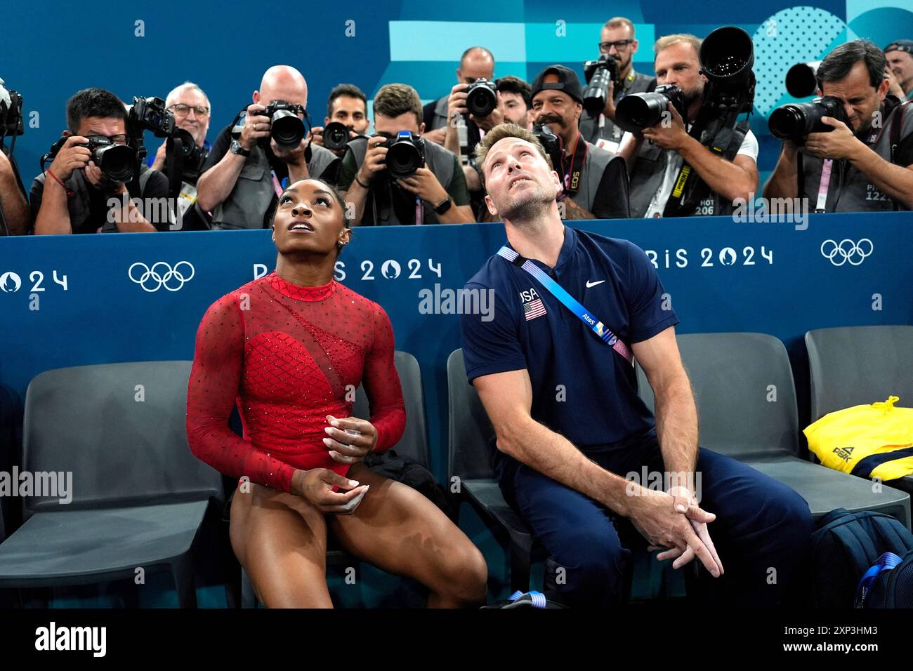Simone Biles, of the United States, waits to see her score during the ...