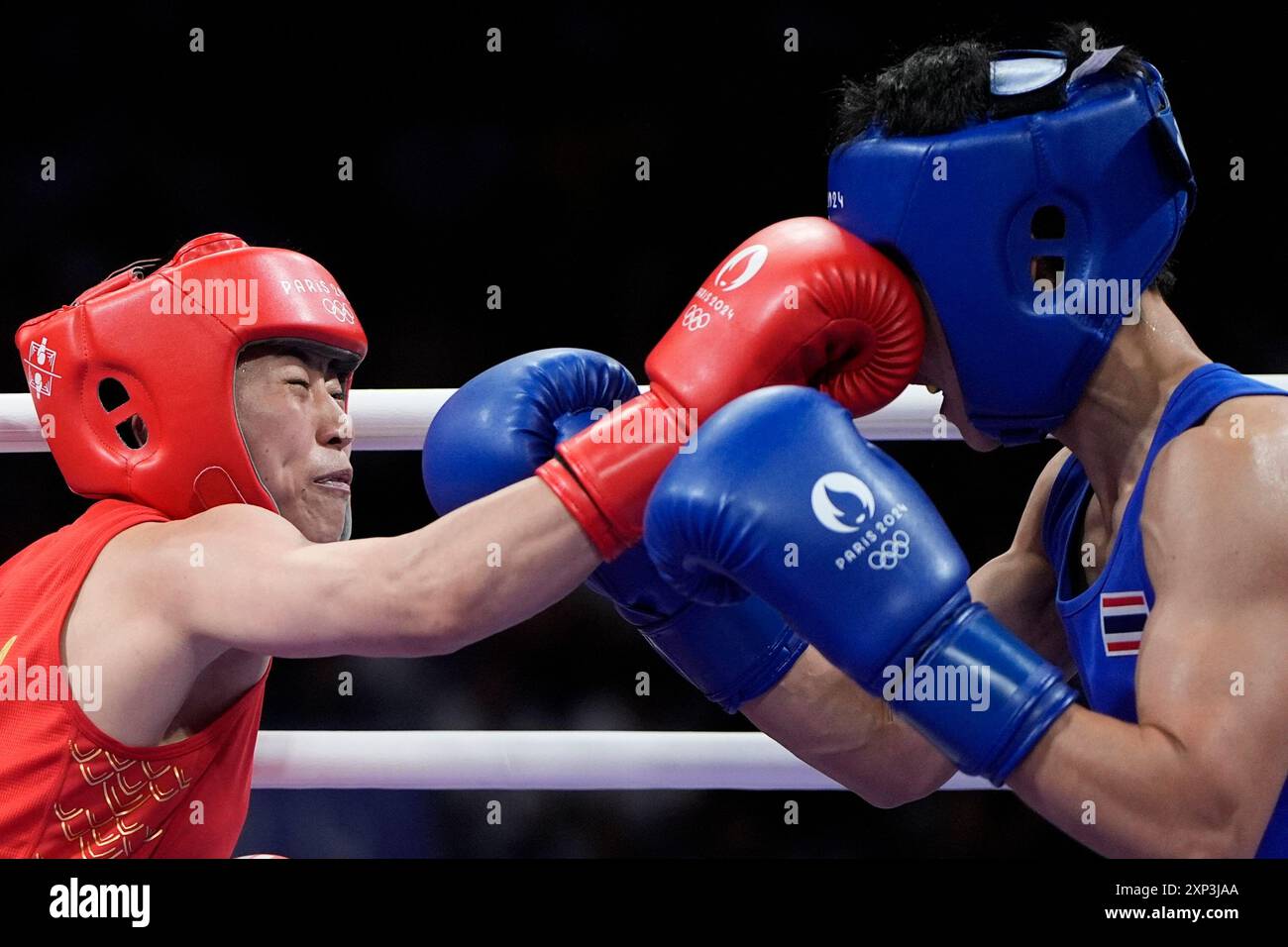 China's Wu Yu, left, fights Thailand's Chuthamat Raksat in there women ...