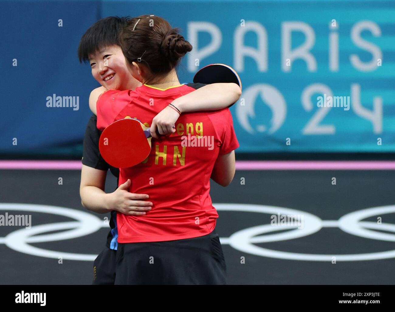Paris, France. 3rd Aug, 2024. China's Chen Meng (front) hugs Sun ...