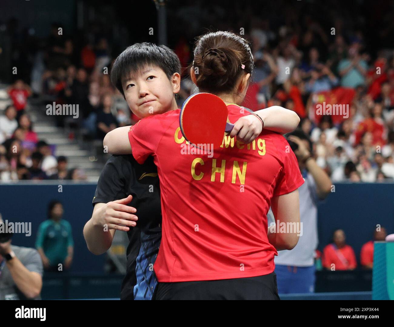 Paris, France. 3rd Aug, 2024. China's Chen Meng (R) hugs Sun Yingsha after the women's singles ...