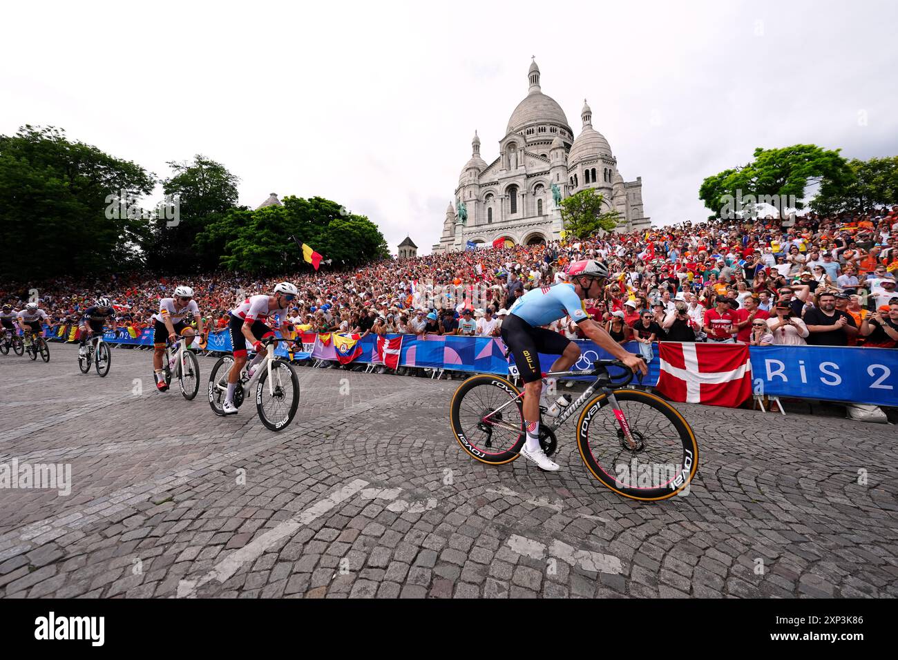 Belgium's Remco Evenepoel passes the Basilique du Sacre Coeur de ...
