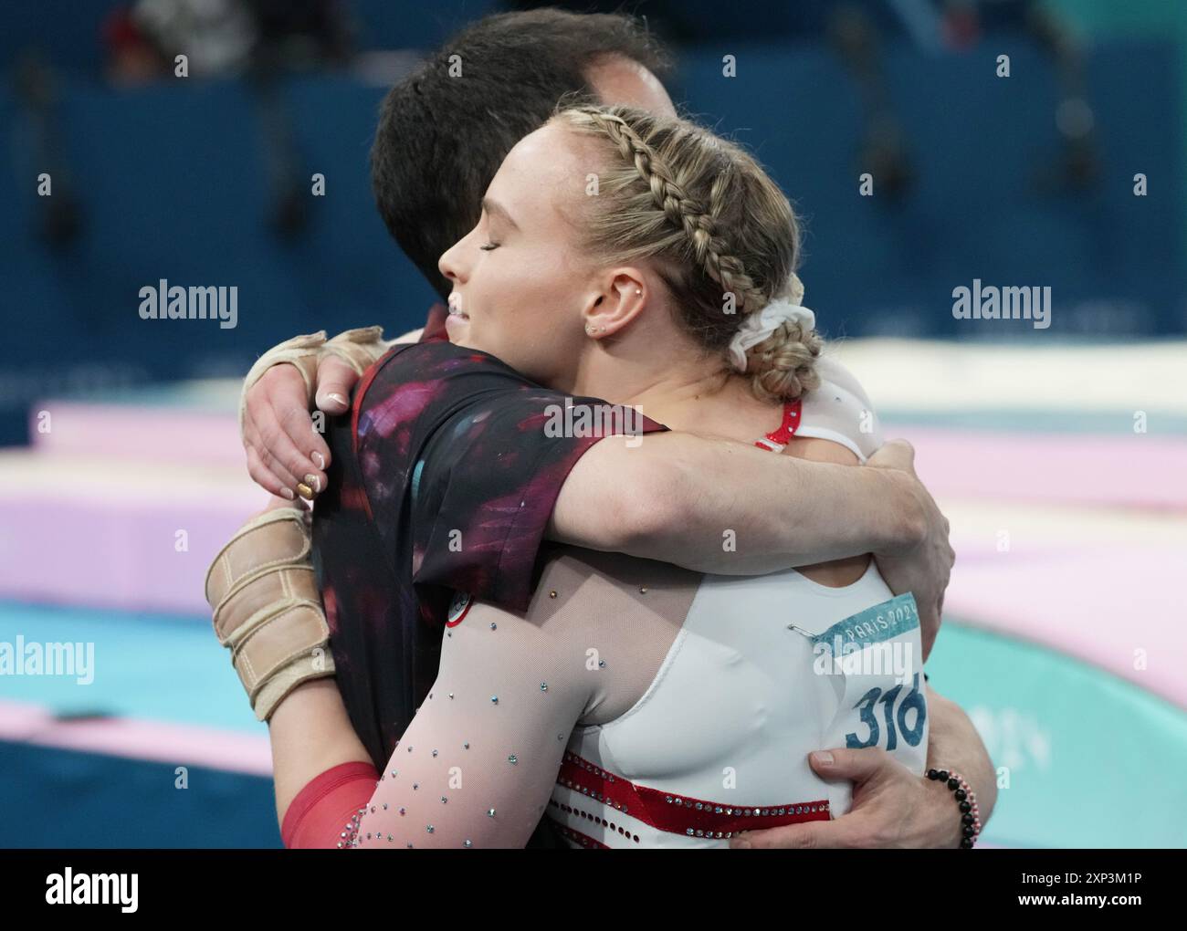 Paris, France. 03rd Aug, 2024. Elsabeth Black of Canada hugs her coach ...