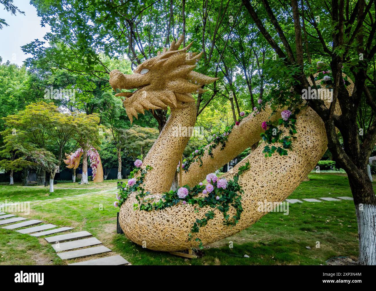 A large decorative dragon sculpture in a public park. Chengdu, Sichuan ...