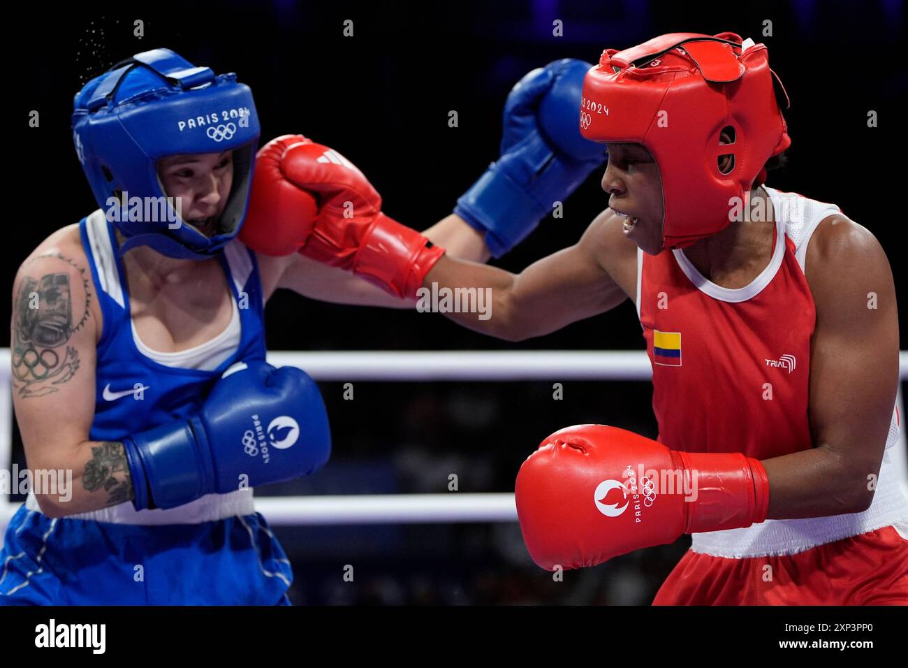 Colombia's Ingrit Valencia, right, fights Kazakhstan's Nazym Kyzaibay ...