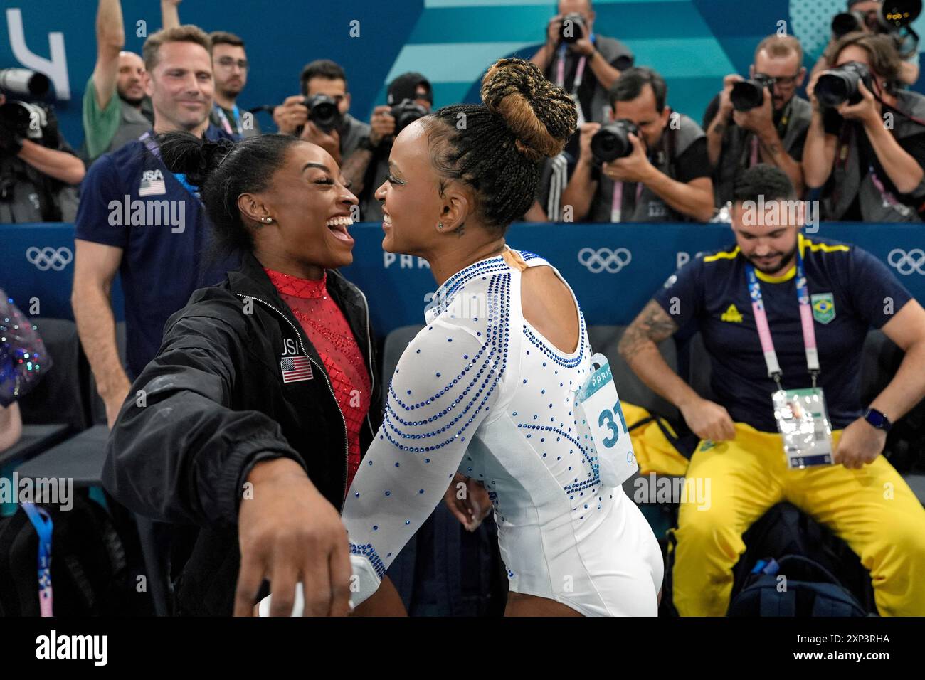 Rebeca Andrade, of Brazil, celebrates with Simone Biles, left, of the ...