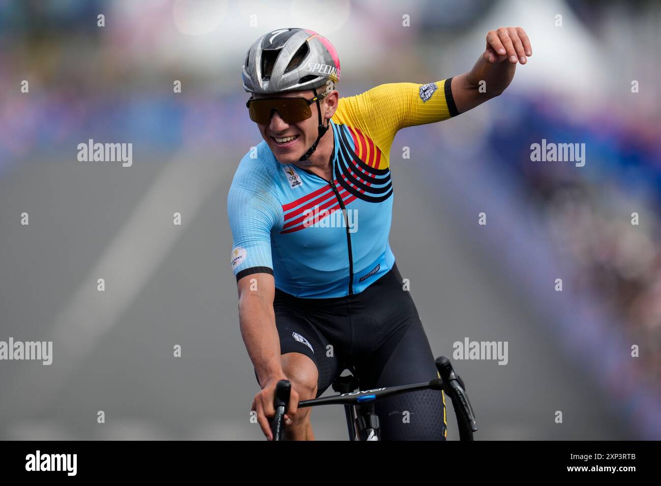 Remco Evenepoel, of Belgium, celebrates winning the men's road cycling ...