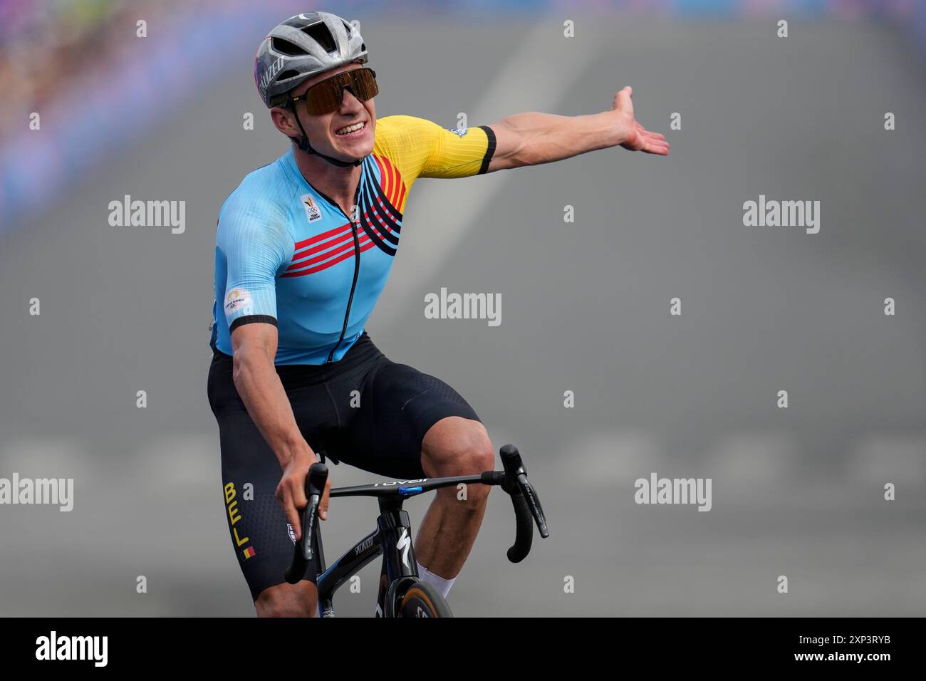 Remco Evenepoel, of Belgium, celebrates winning the men's road cycling ...