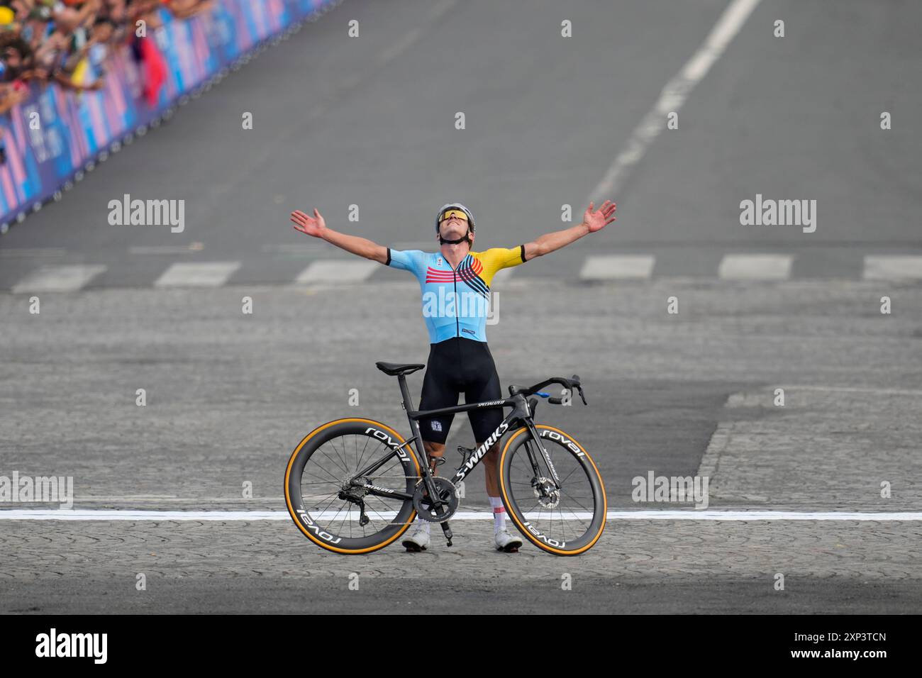 Remco Evenepoel, of Belgium, celebrates winning the men's road cycling ...