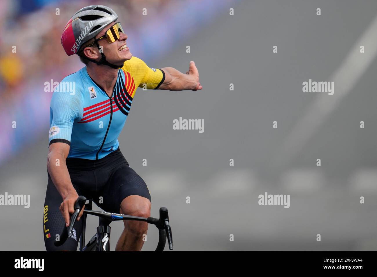 Remco Evenepoel, of Belgium, celebrates winning the men's road cycling ...