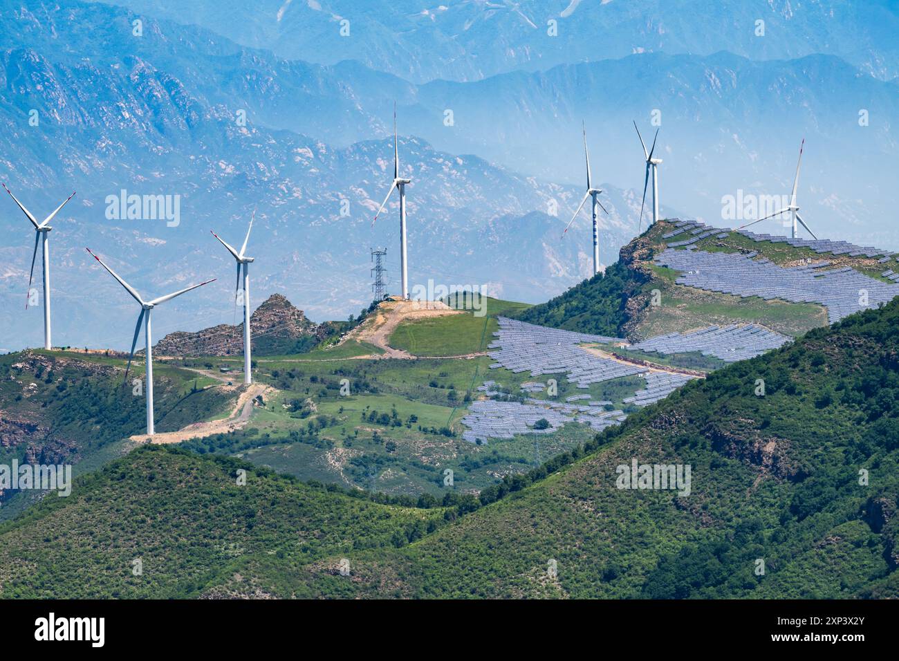 Solar panels and wind turbines on the hills outside Beijing, China ...