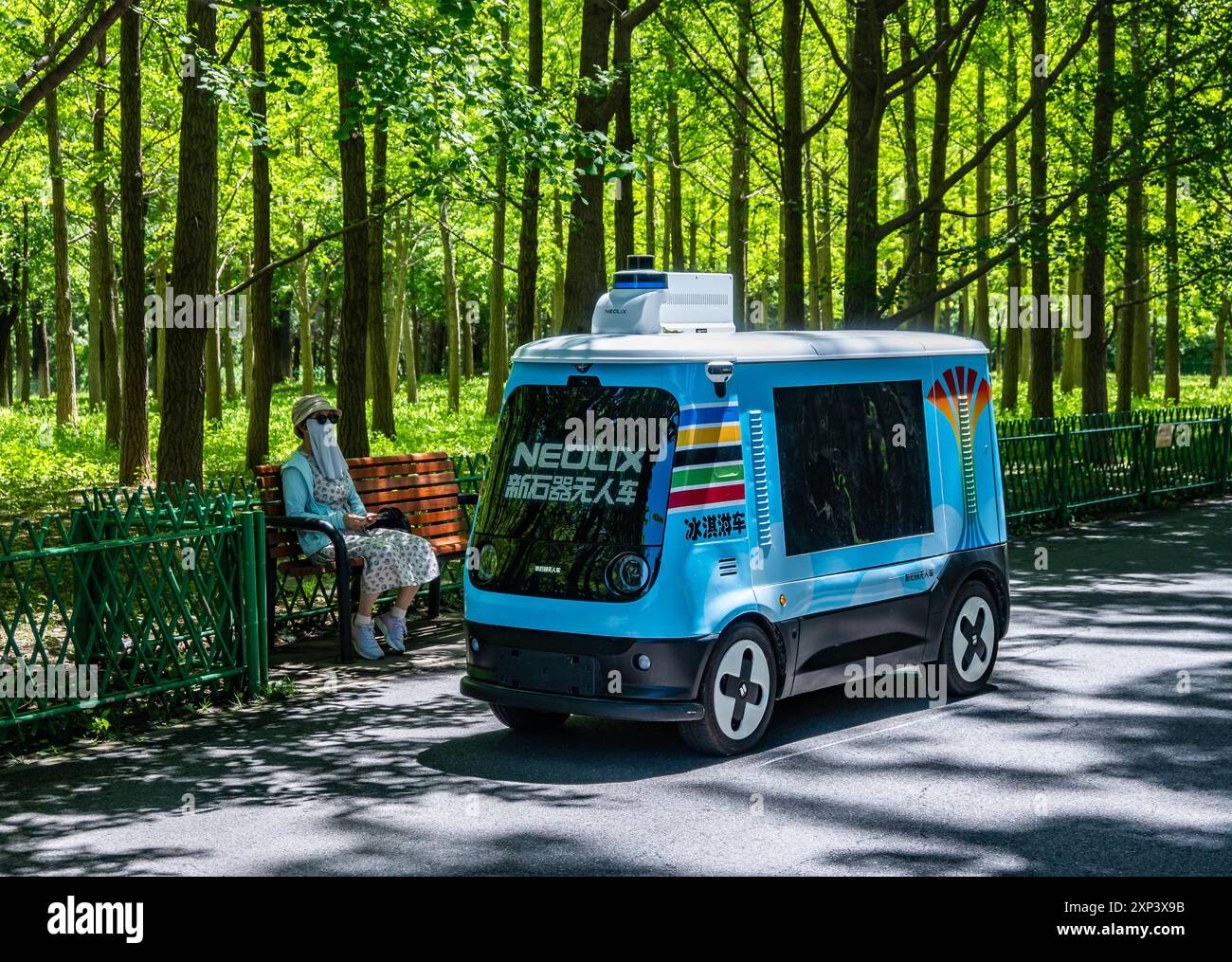 A driverless car selling ice cream in a public park. Beijing, China ...